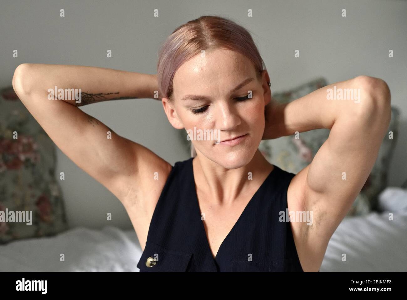Woman arms behind head hi-res stock photography and images - Alamy