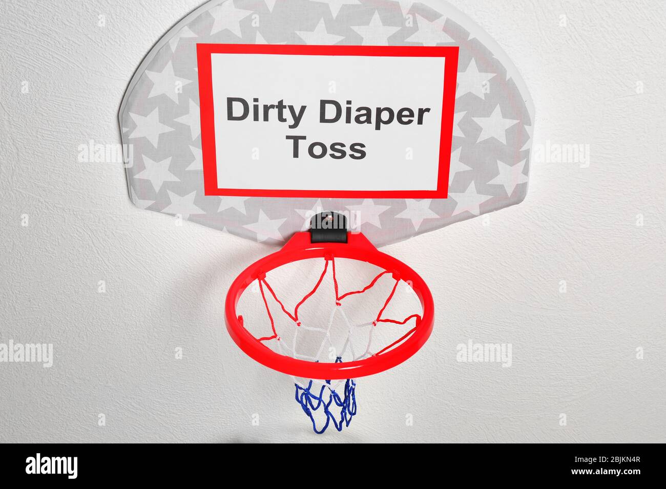 Basketball hoop on wall for game at baby shower party Stock Photo - Alamy