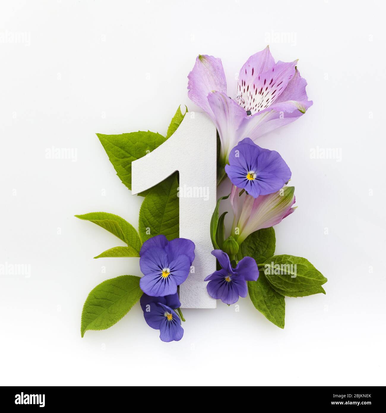 Creative layout with colourful flowers and number one. Flat lay. Top ...