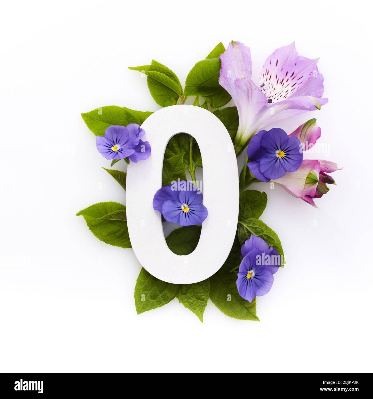 Creative layout with colourful flowers and number zero. Flat lay. Top ...