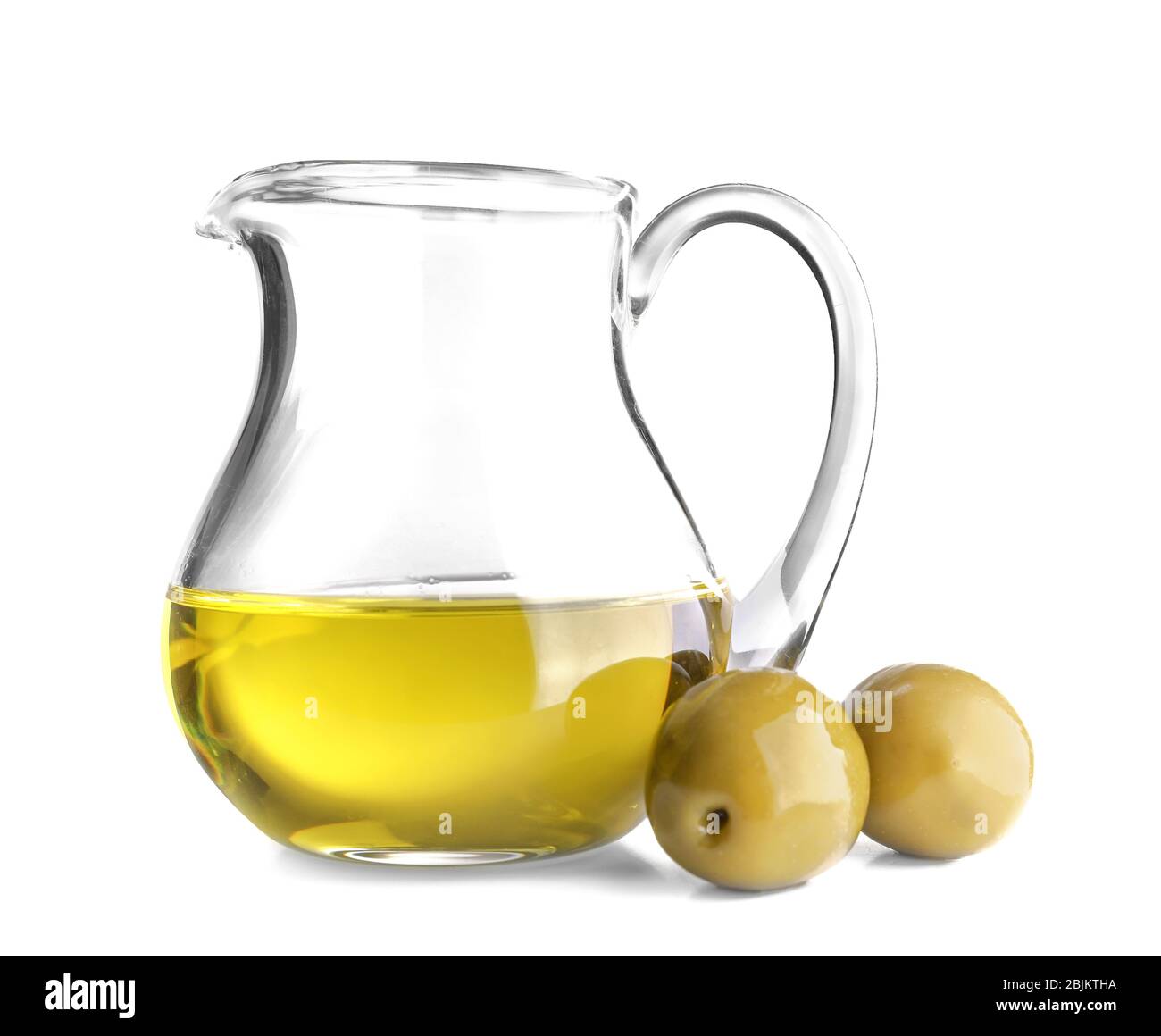 Pitcher with olive oil on white background Stock Photo - Alamy