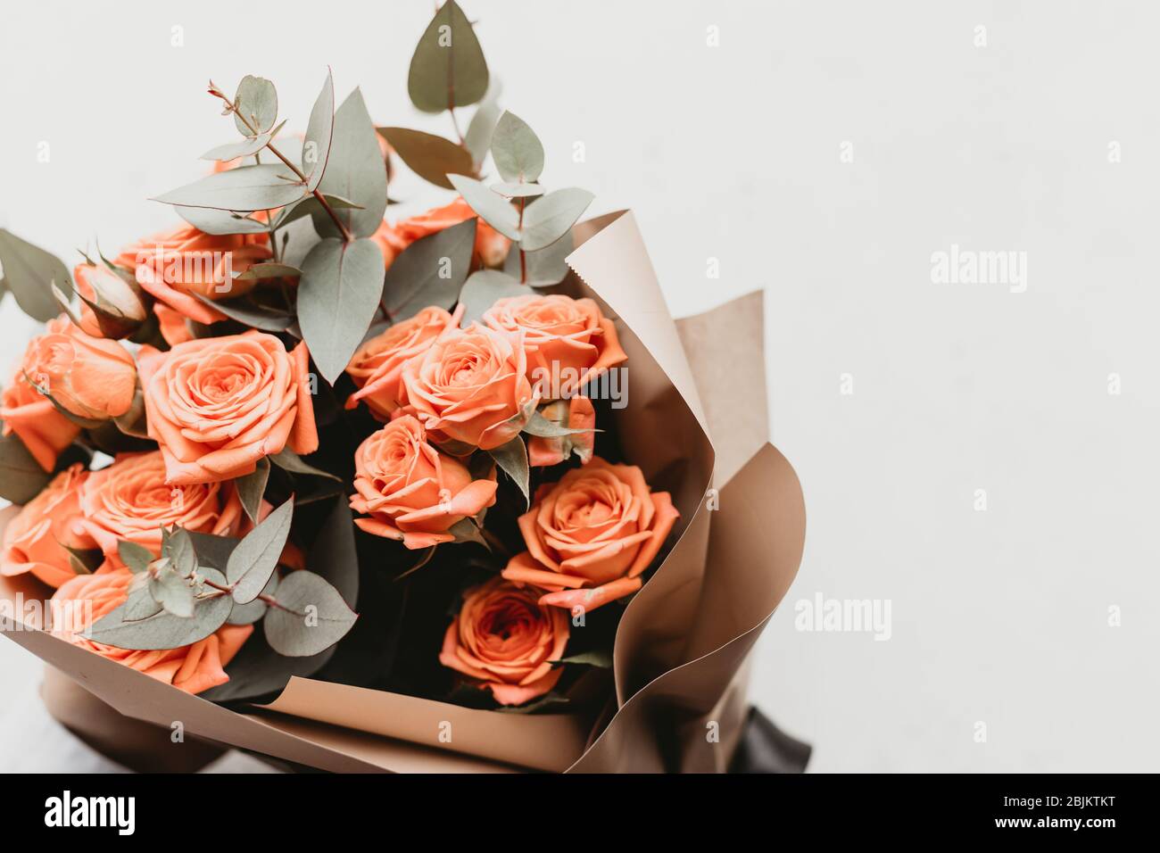 Bouquet is made from coral spray roses and eucalyptus branches Stock ...