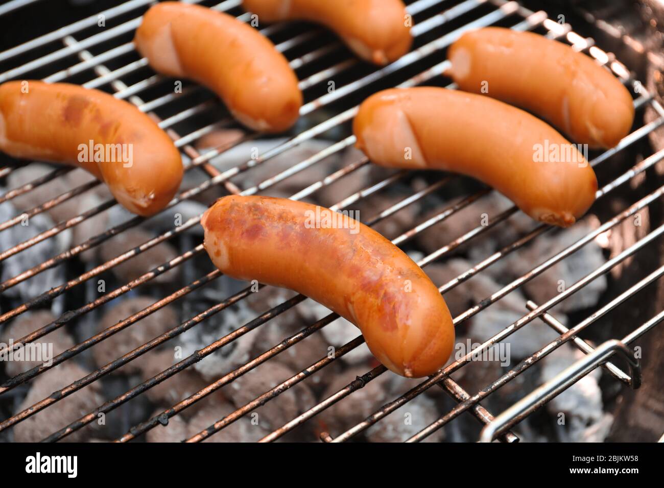Sausages on barbecue grill Stock Photo - Alamy