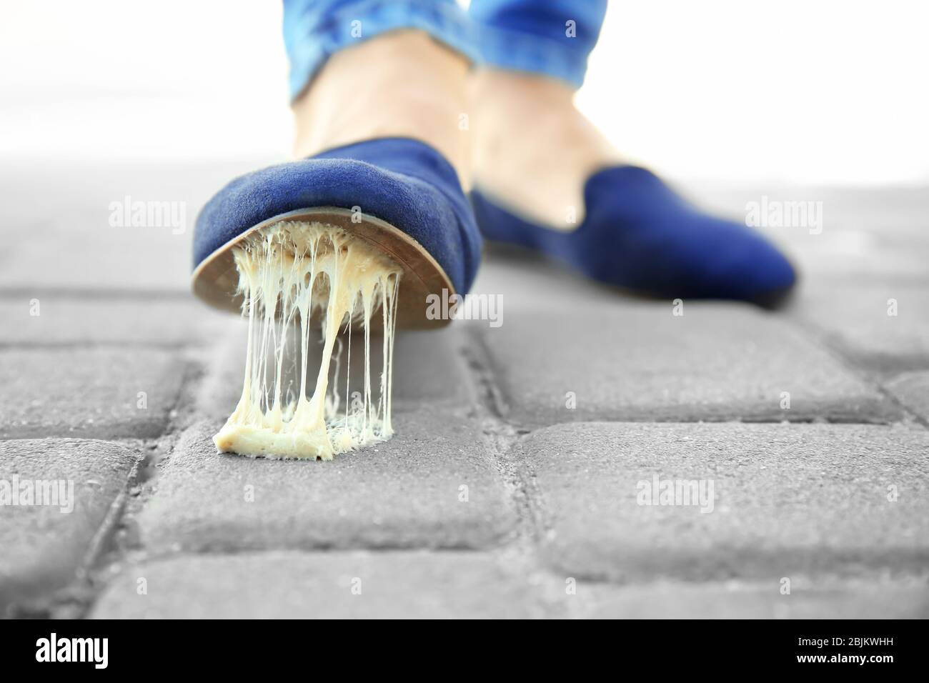 Male foot stuck into chewing gum on street. Concept of stickiness Stock ...
