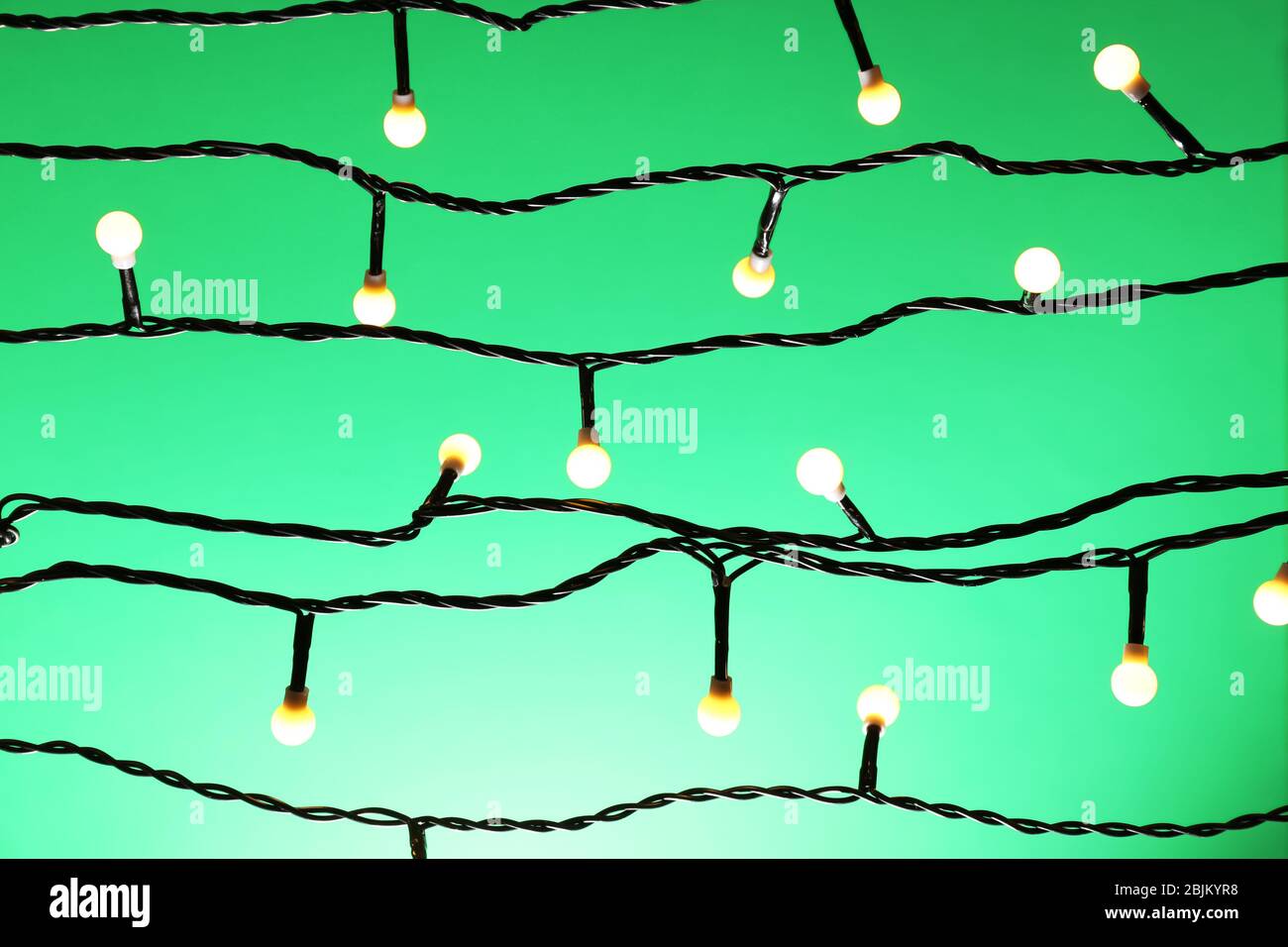 Christmas lights on color background Stock Photo - Alamy