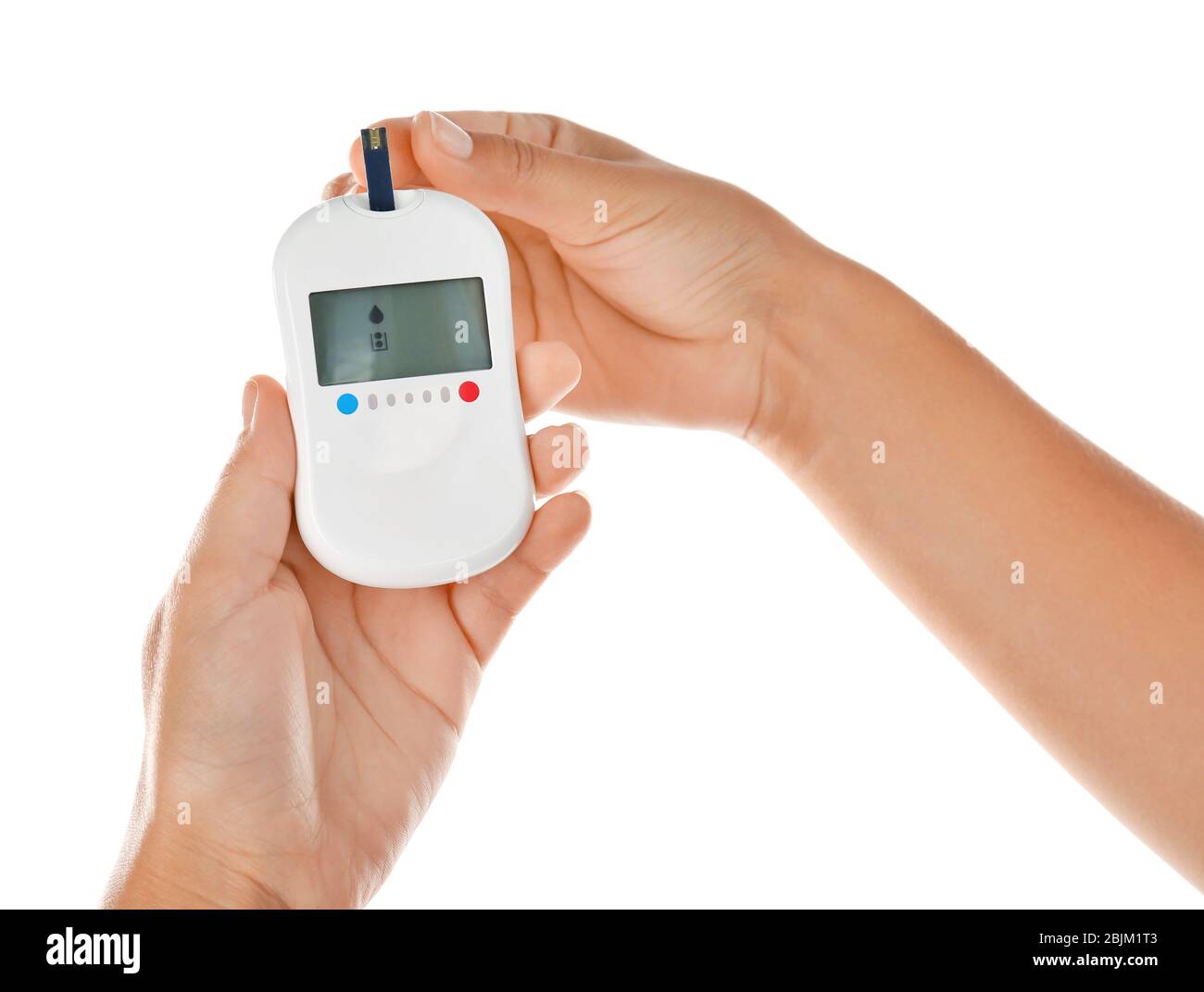Woman testing glucose level with digital glucometer on white background ...