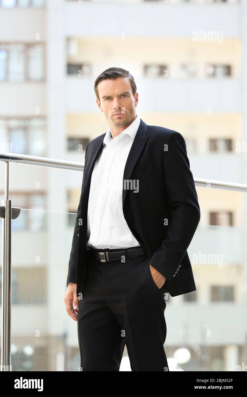 Man in tailored black suit hi-res stock photography and images - Alamy