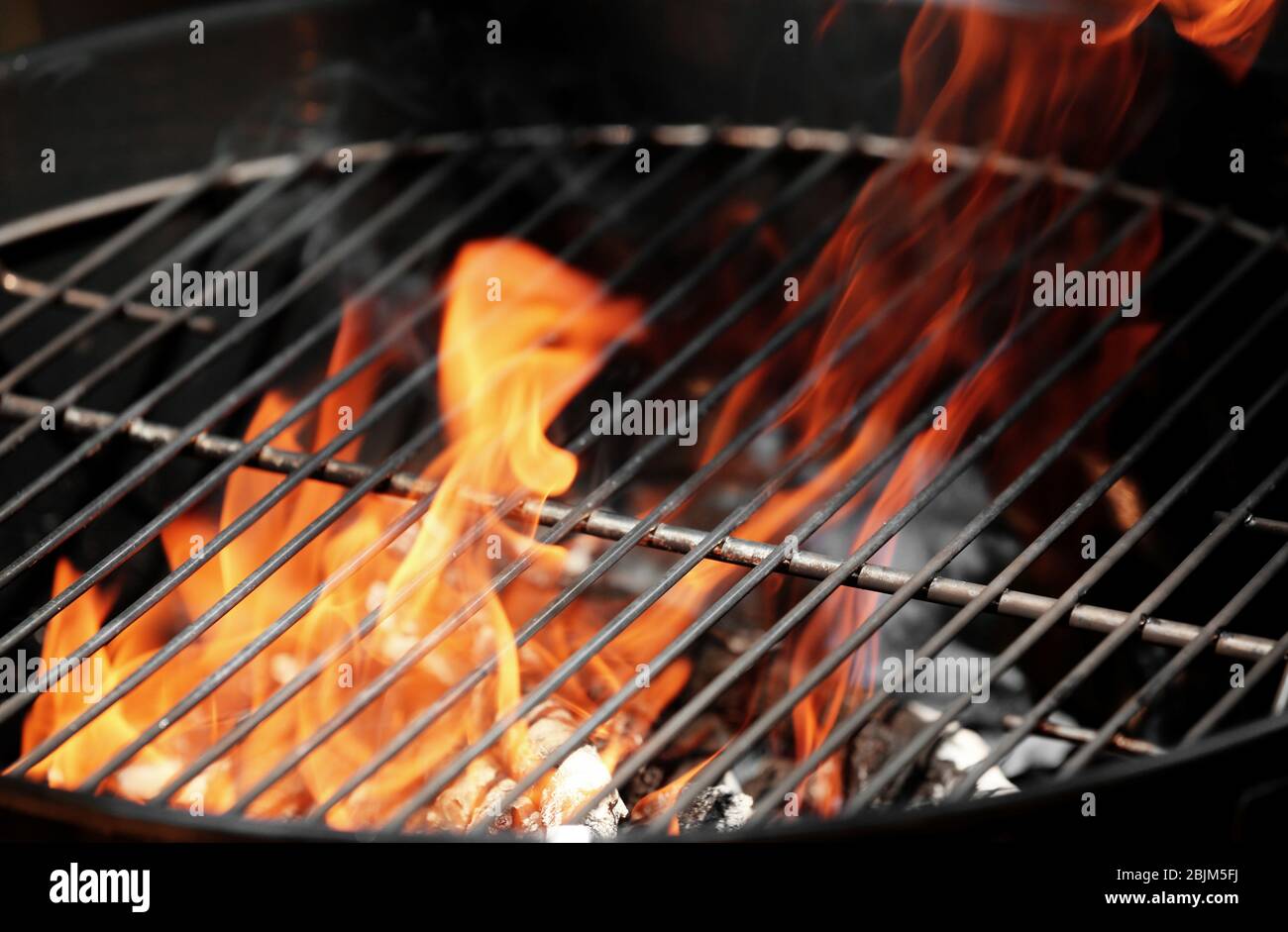 Empty grill with flame Stock Photo - Alamy
