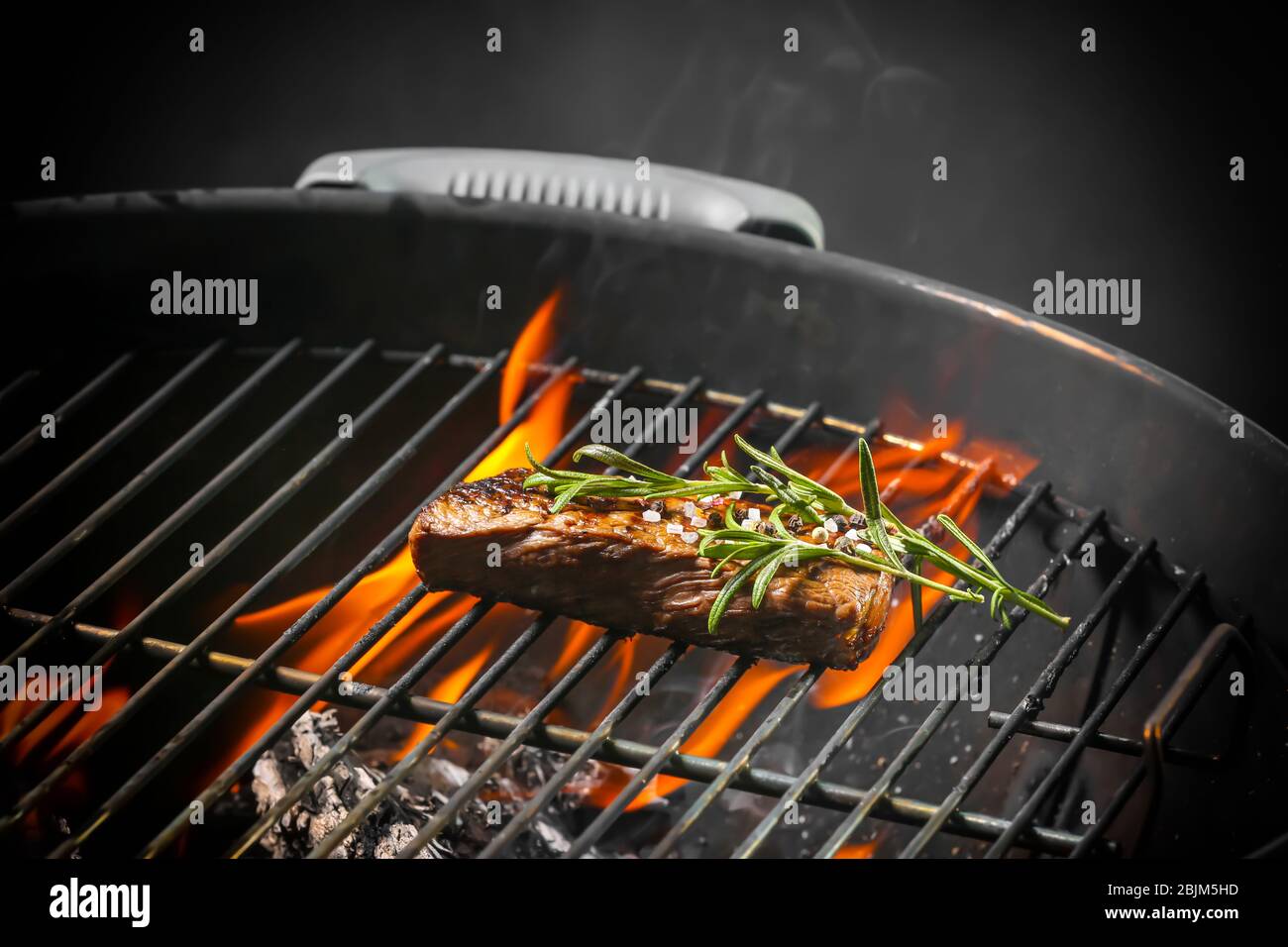 Delicious cooked meat on grill Stock Photo - Alamy
