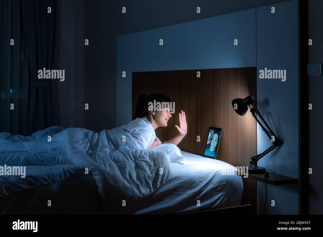 Asian woman virtual happy hour meeting online together with her ...