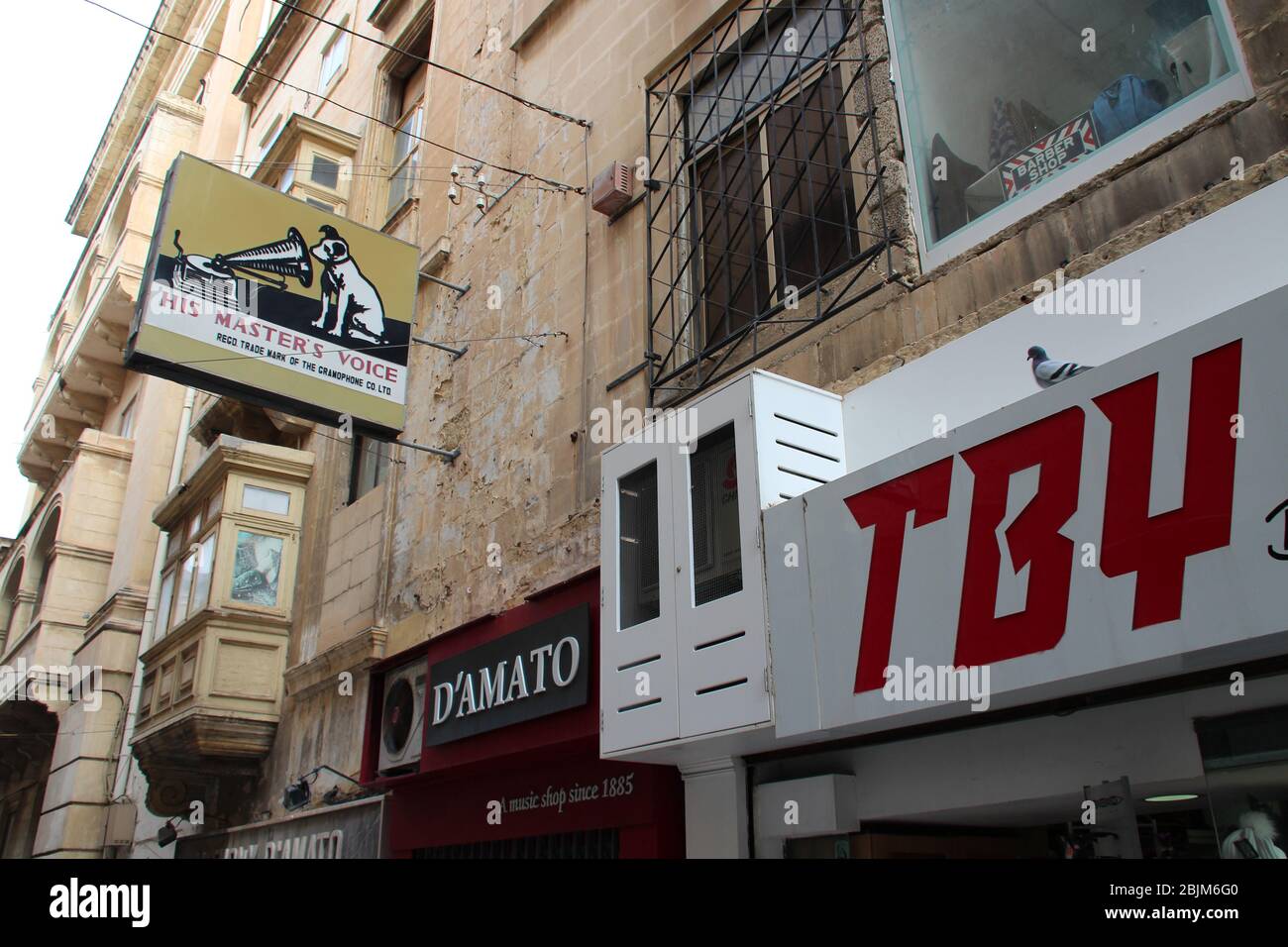 buildings with signs of shops in valletta (malta Stock Photo - Alamy