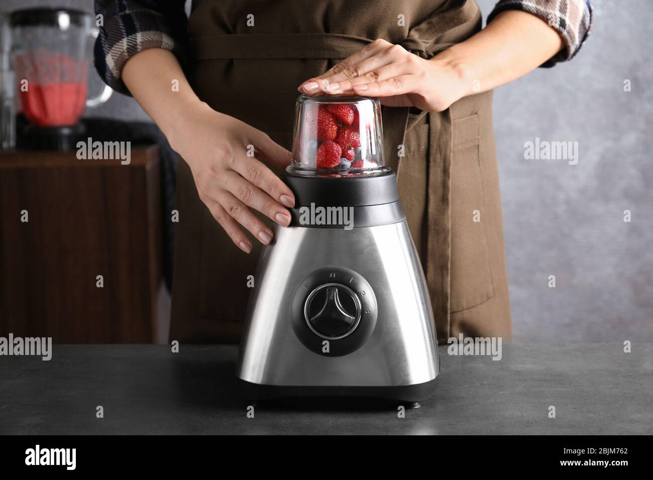 Woman preparing smoothie hi-res stock photography and images - Alamy