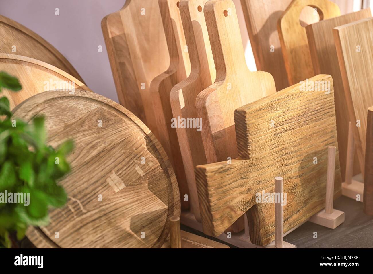 Different wooden boards on table in kitchen Stock Photo - Alamy