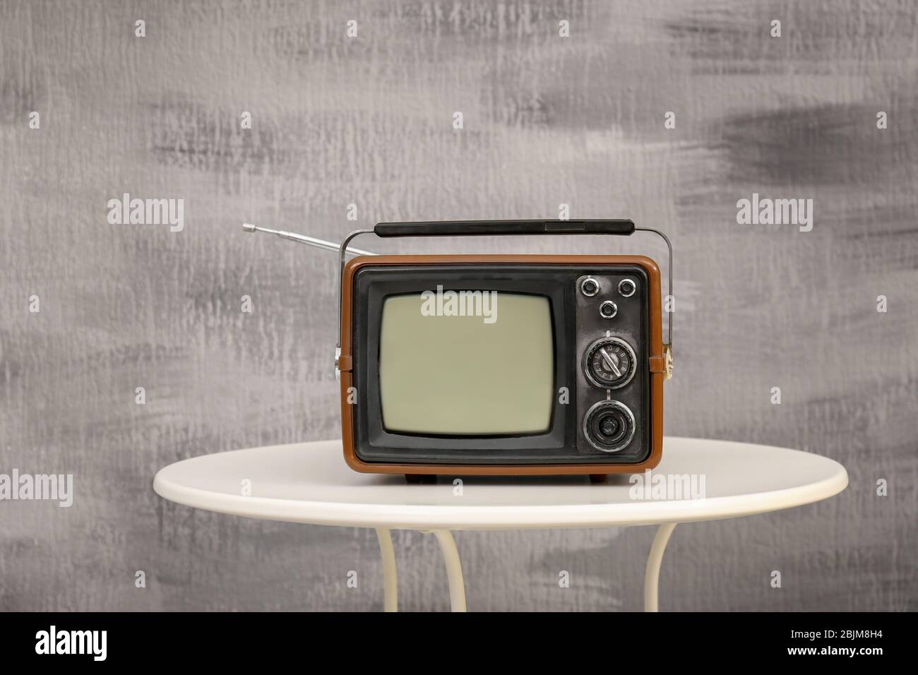 Vintage TV set on table Stock Photo - Alamy