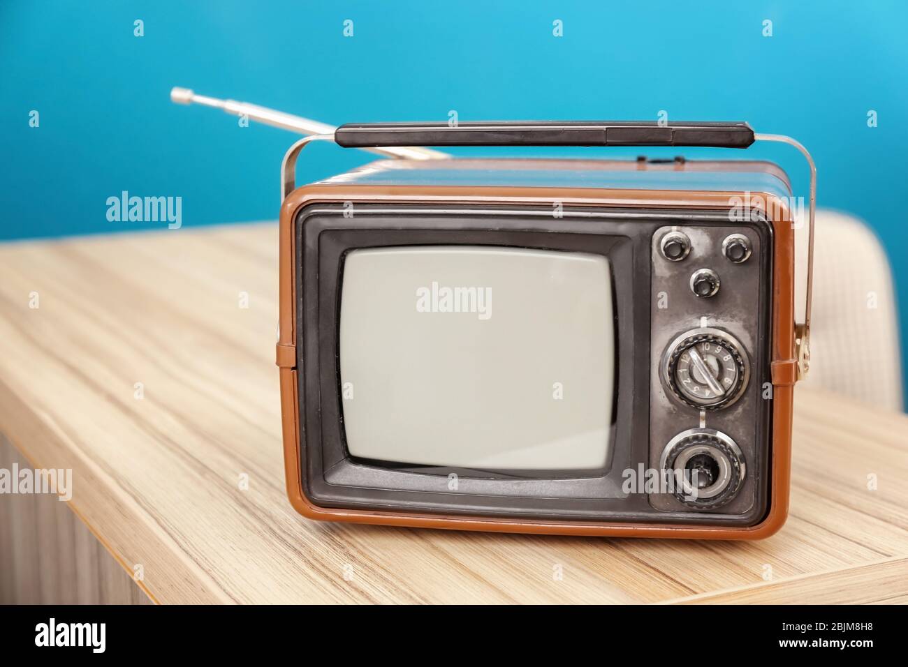 Old vintage TV on wooden table Stock Photo - Alamy