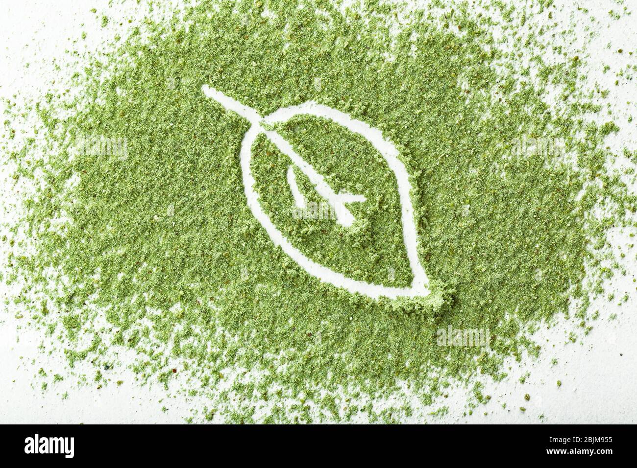 Leaf made of wheat grass powder on white background Stock Photo - Alamy