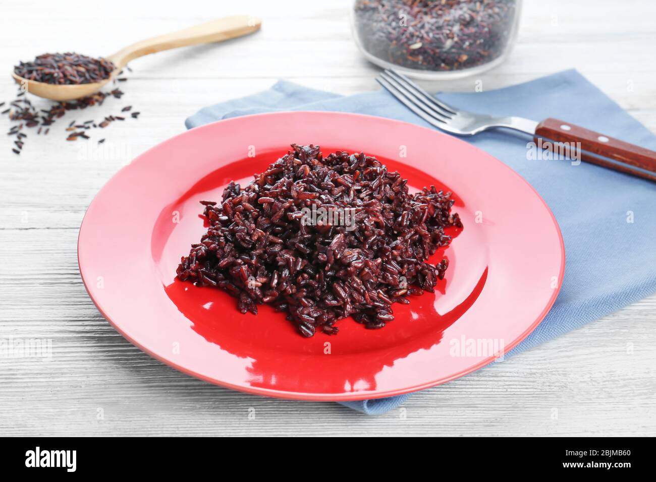 Plate with cooked rice on table Stock Photo - Alamy