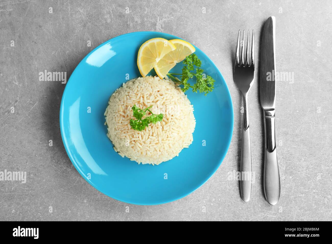 Plate with cooked rice ball on table Stock Photo - Alamy