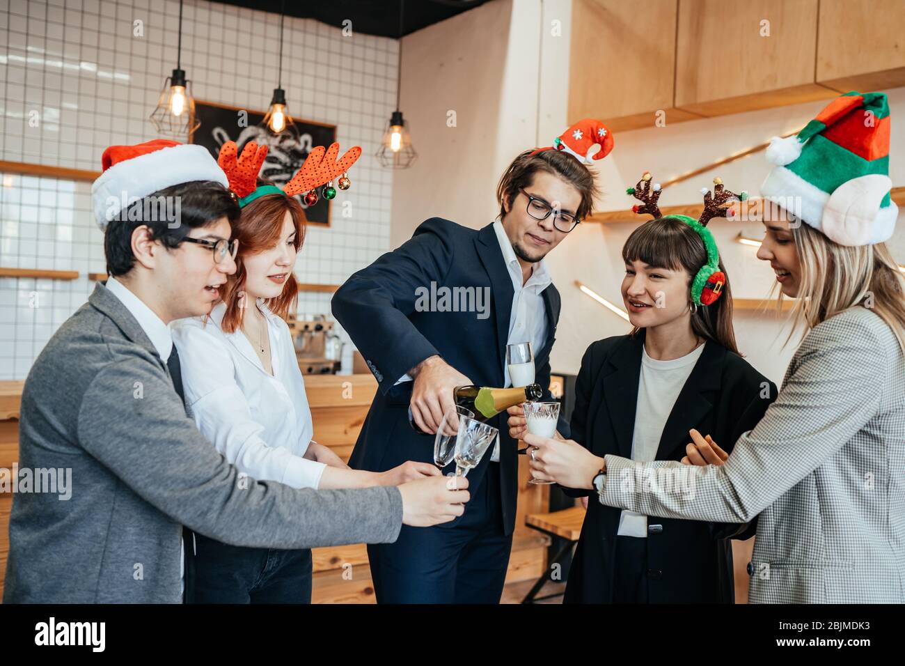 Happy colleagues in office celebrate special event Stock Photo - Alamy