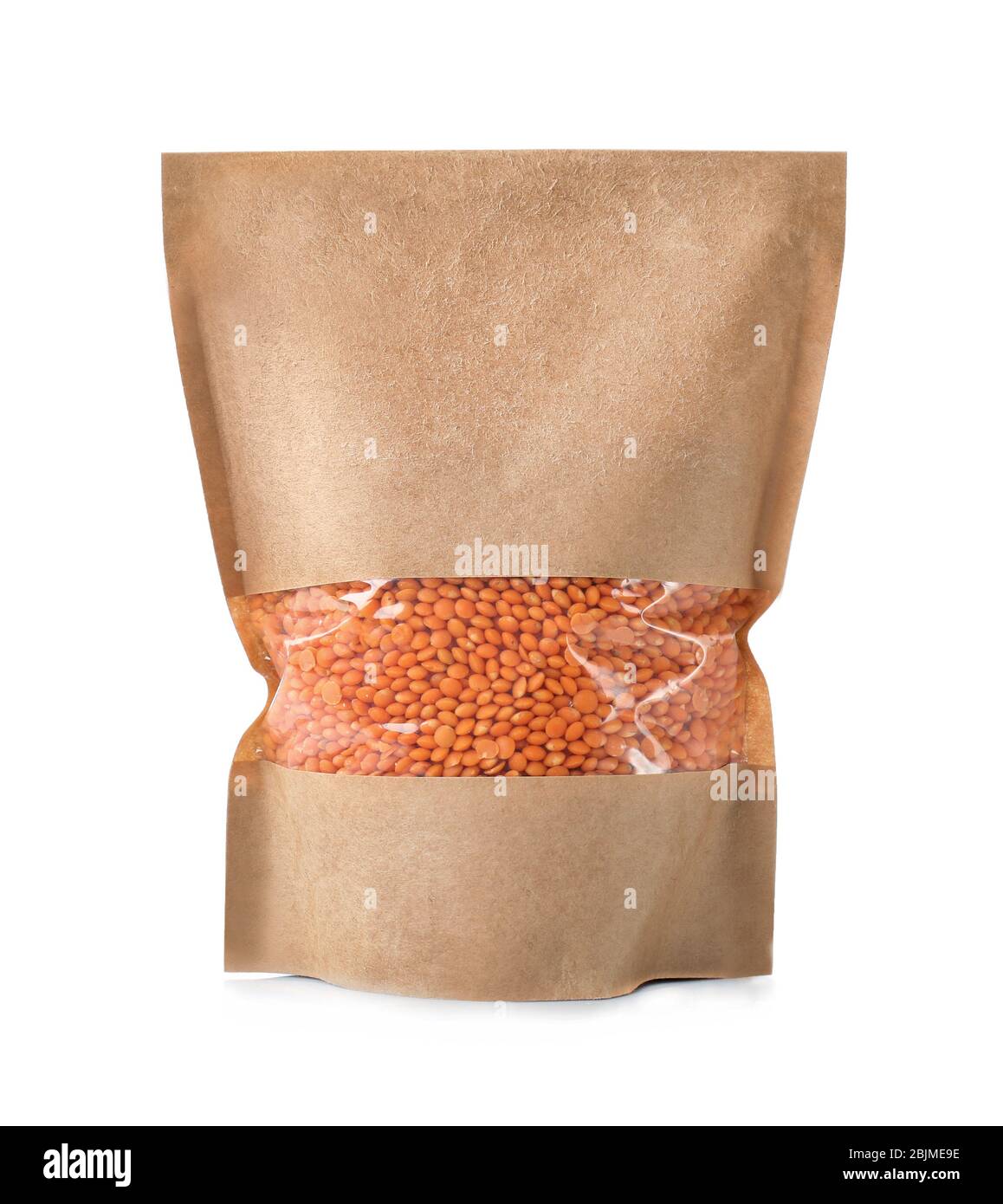 Paper package with red lentils on white background Stock Photo - Alamy