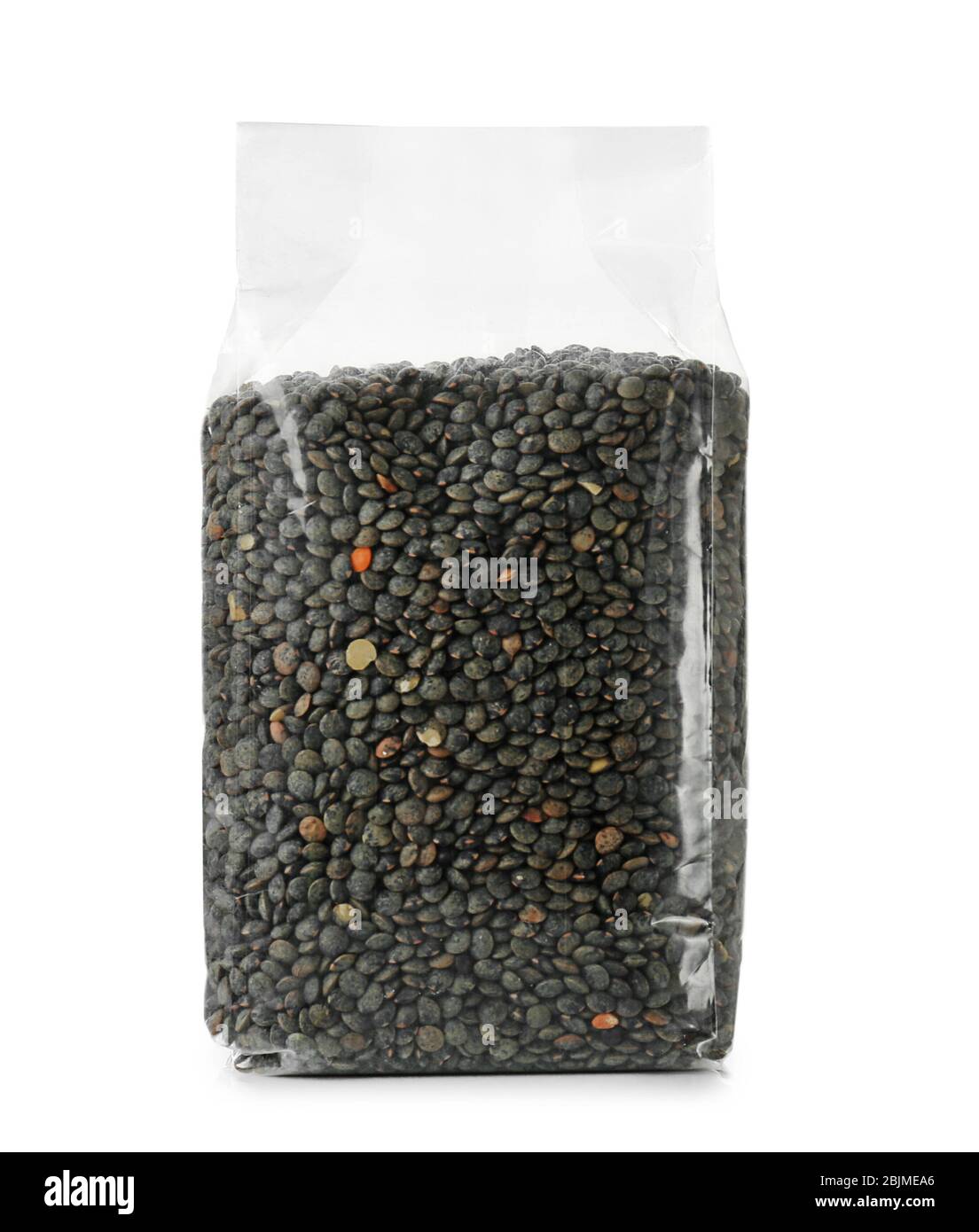 Plastic package with french green lentils on white background Stock ...