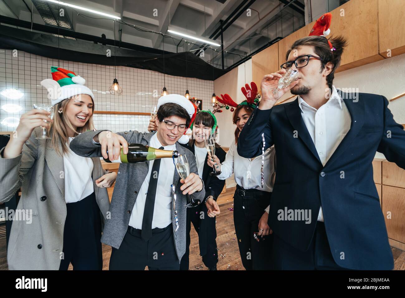 Happy colleagues in office celebrate special event Stock Photo - Alamy