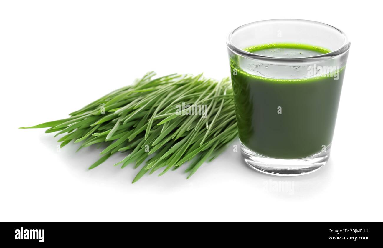 Shot of wheat grass drink on white background Stock Photo - Alamy