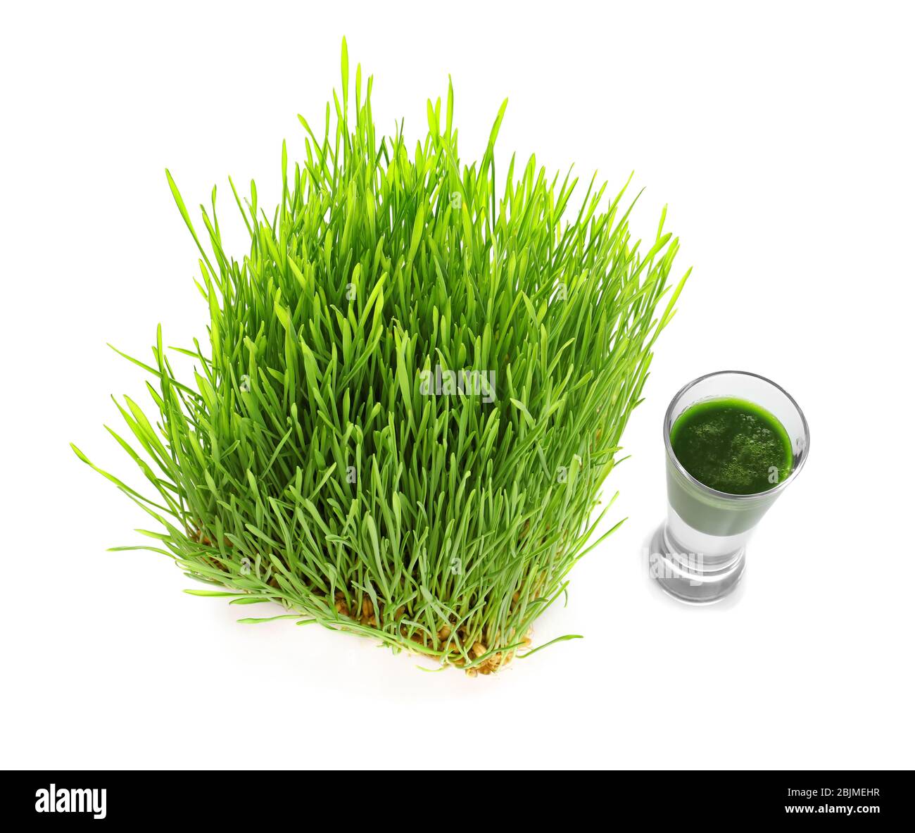 Shot of wheat grass drink on white background Stock Photo - Alamy