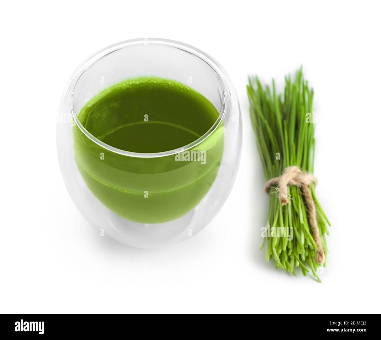 Shot of wheat grass drink on white background Stock Photo - Alamy