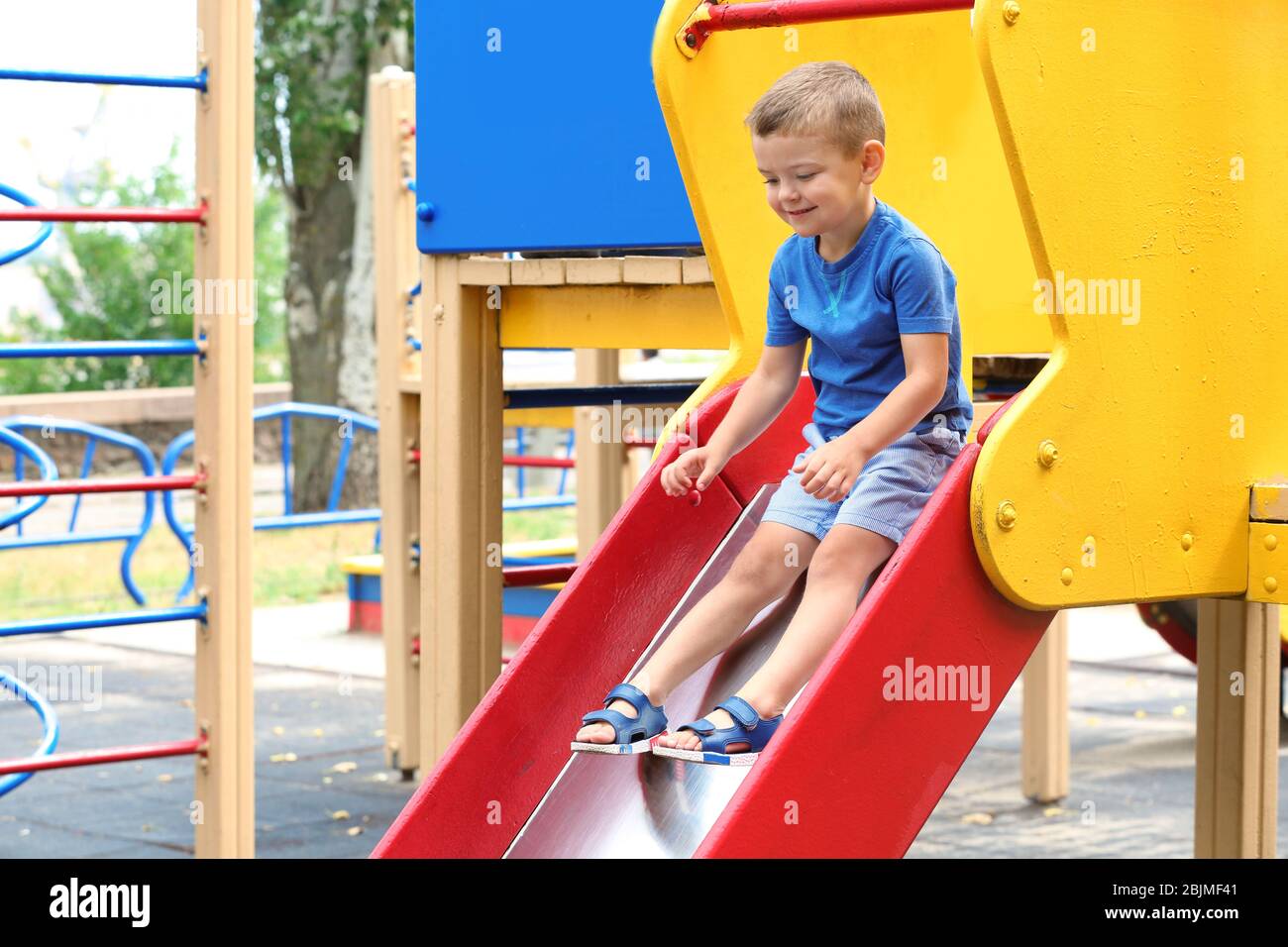 Cute little boy on playground Stock Photo - Alamy