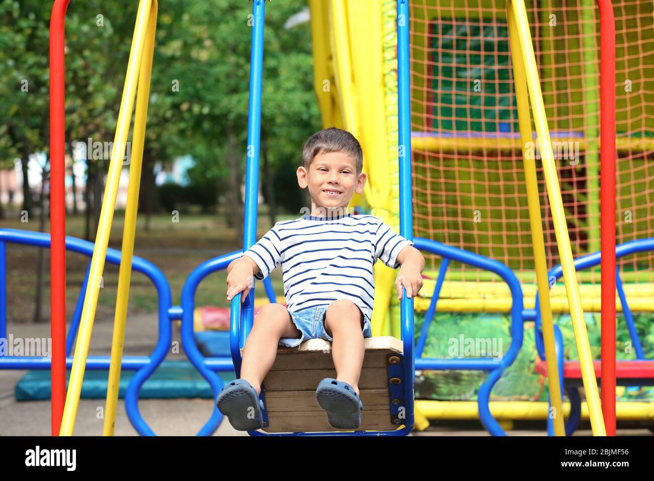 Cute little boy on playground Stock Photo - Alamy