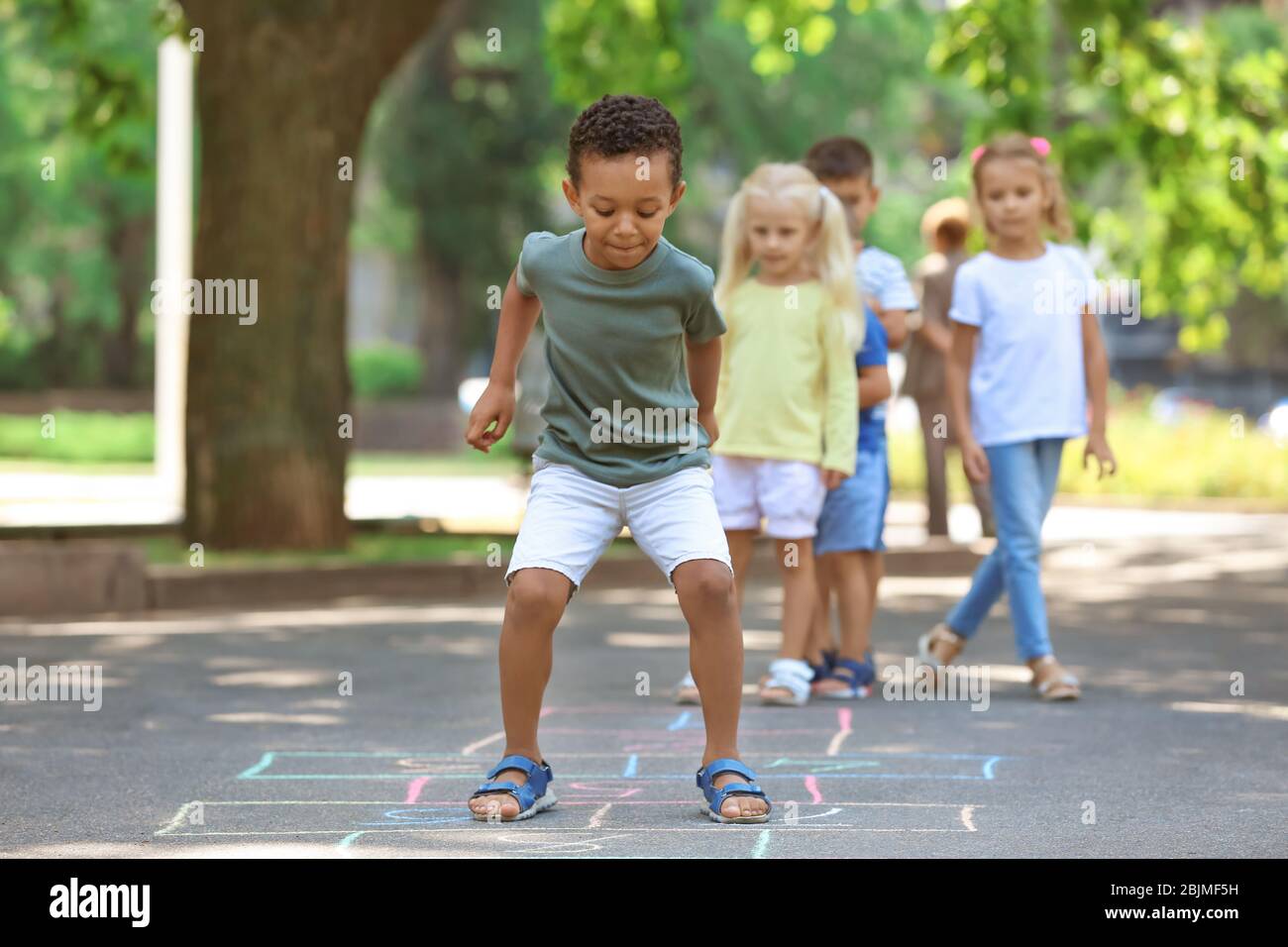 Little children playing hopscotch, outdoors Stock Photo - Alamy