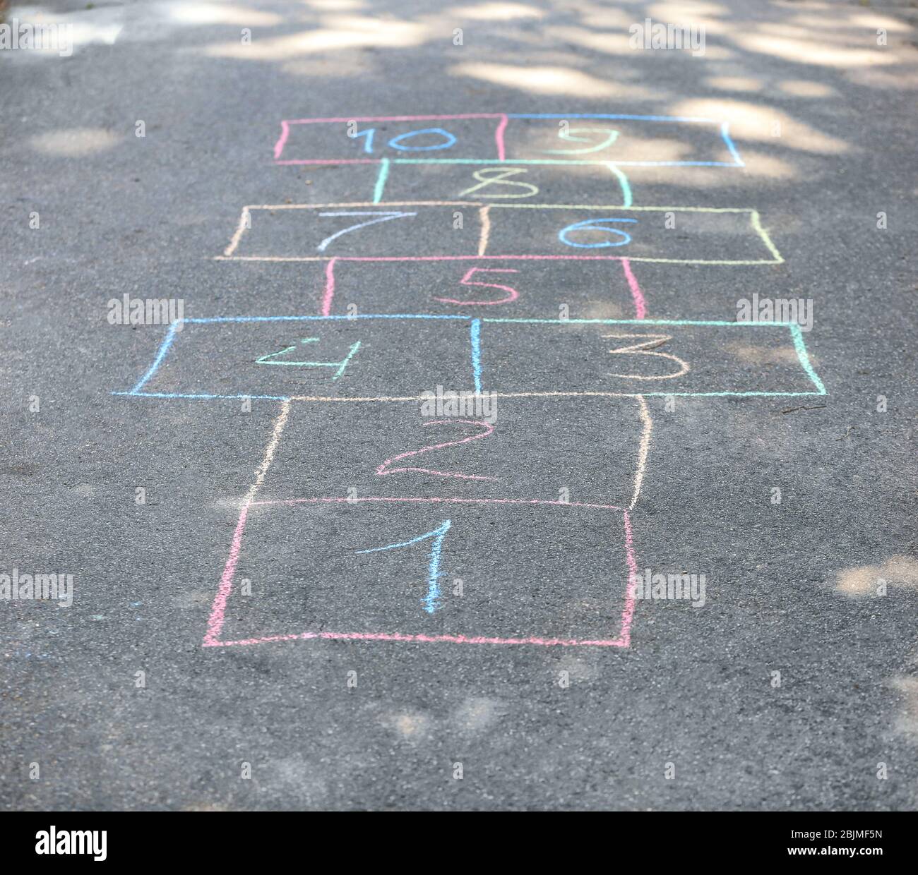 Hopscotch drawn with chalk on asphalt Stock Photo - Alamy