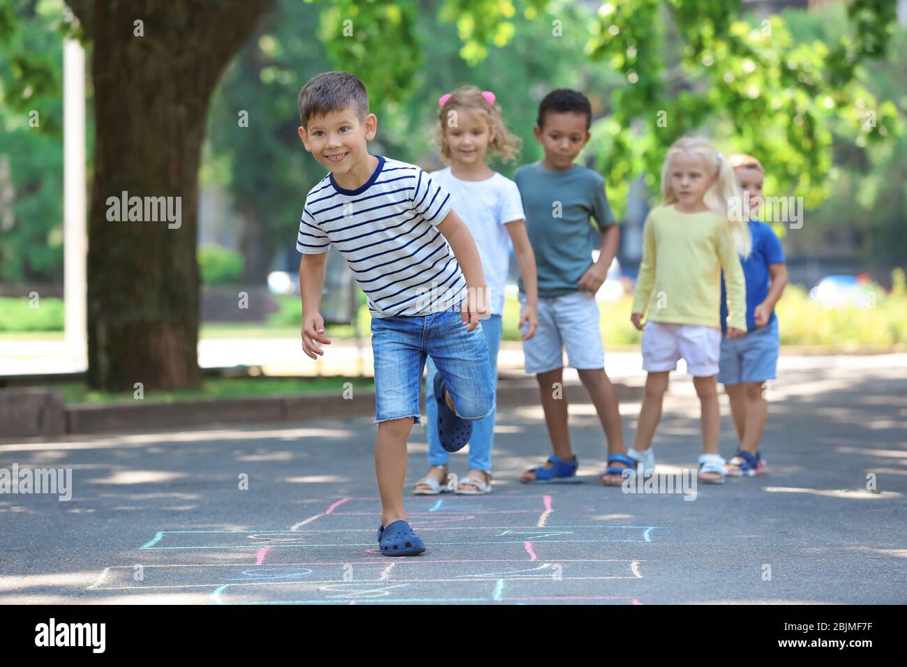Little children playing hopscotch, outdoors Stock Photo - Alamy