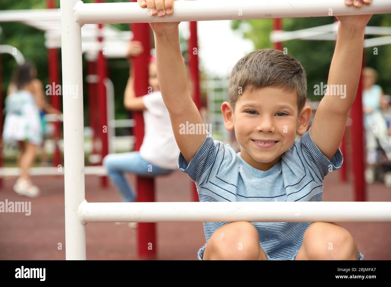 Cute little boy on playground Stock Photo - Alamy