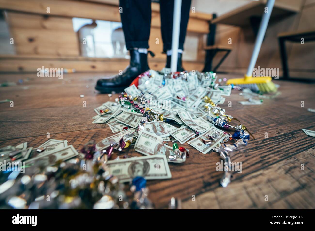 Broom sweeping money hi-res stock photography and images - Alamy