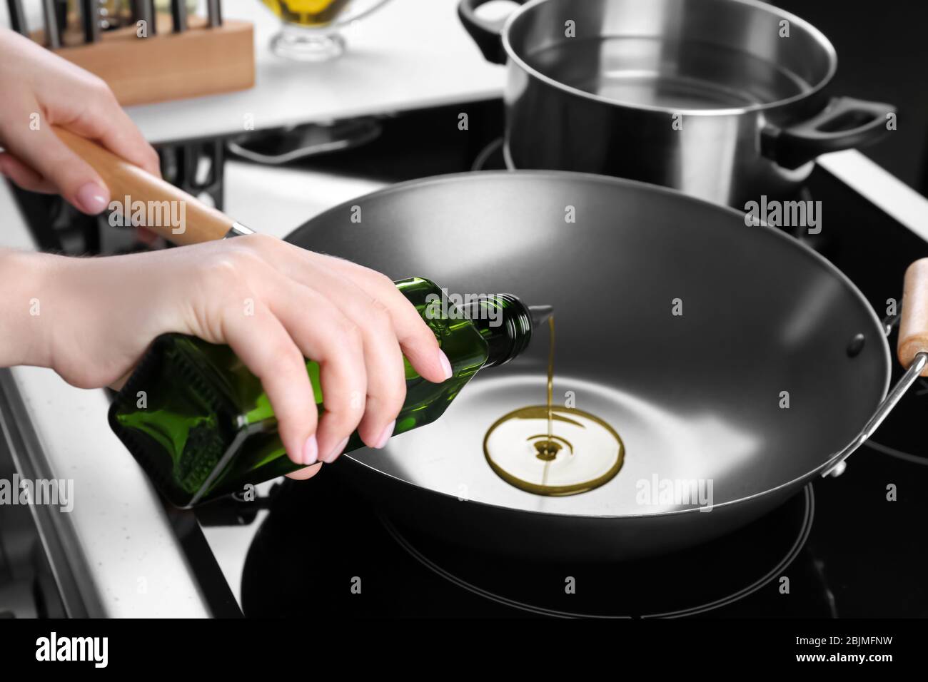 Pouring oil onto recipe hi-res stock photography and images - Alamy