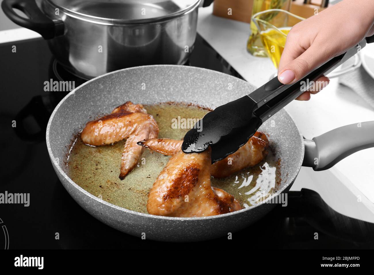 Woman chicken wings hi-res stock photography and images - Alamy