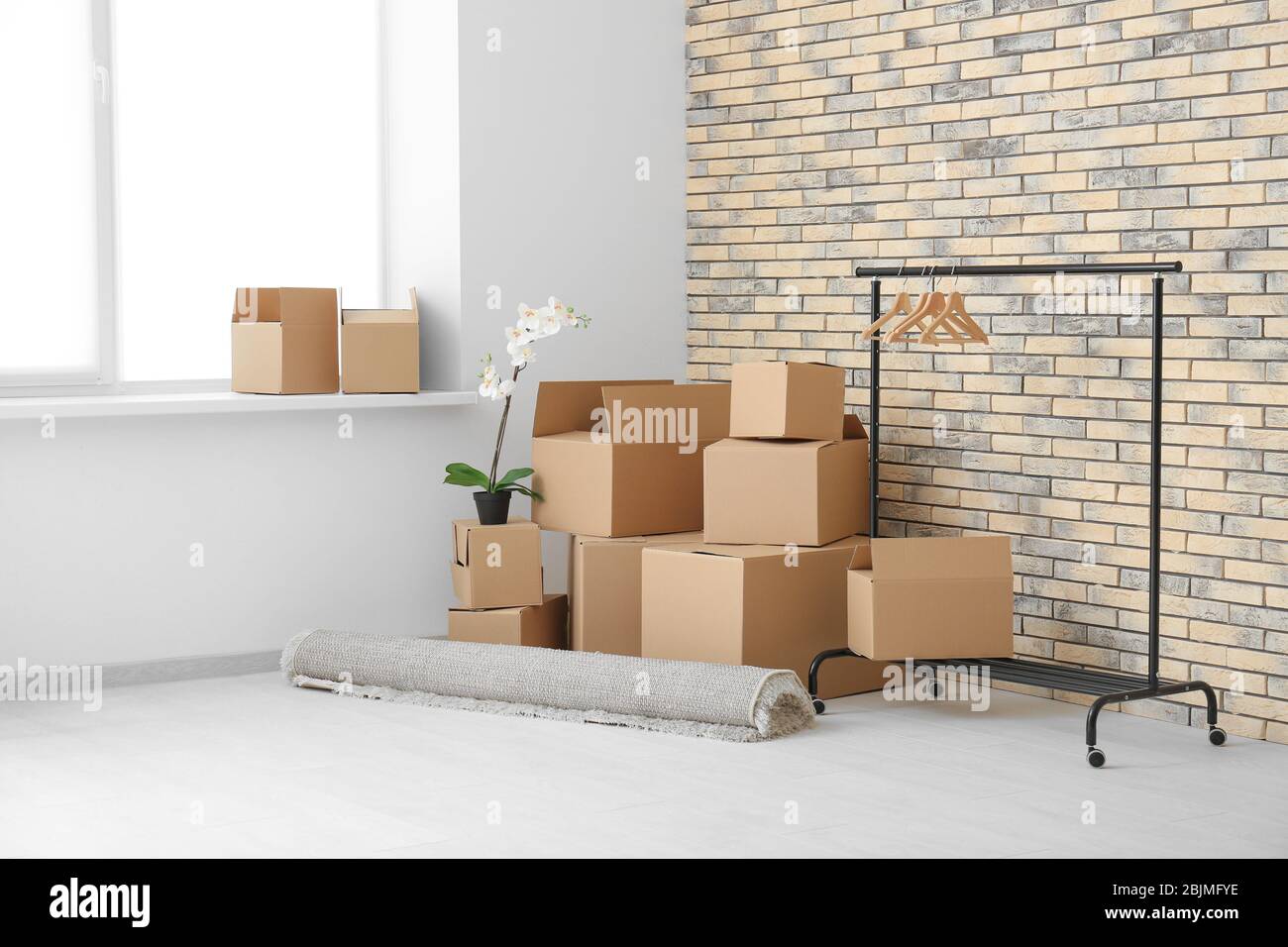 Move house concept. Carton boxes on floor in empty room Stock Photo - Alamy