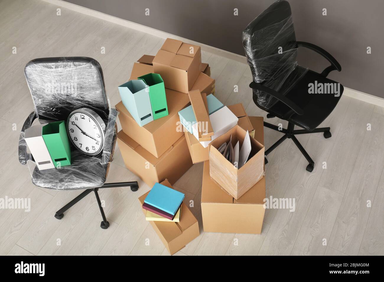 Office move concept. Carton boxes and chairs on floor in empty room ...