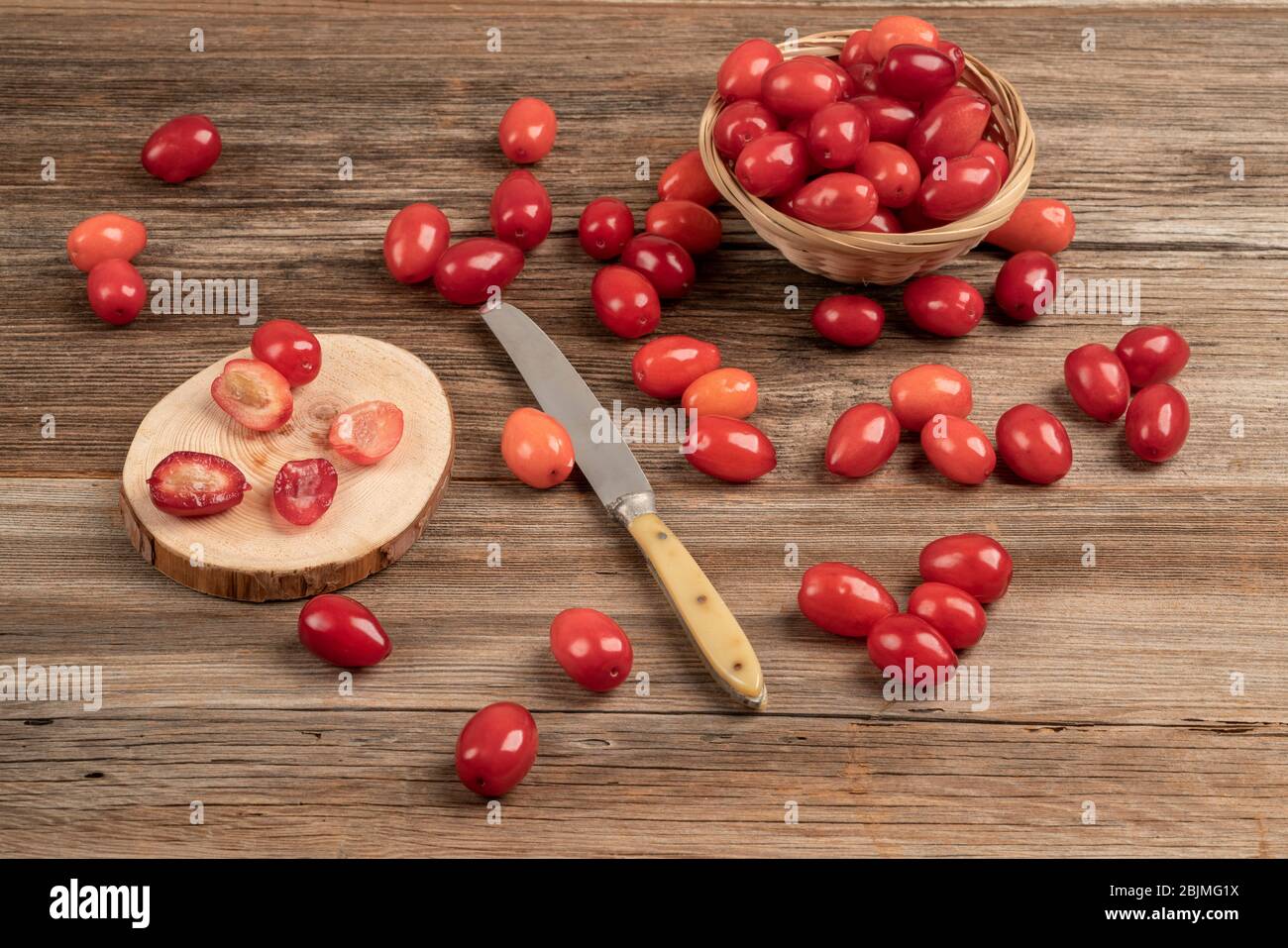 whole and cut into half cranberry fruits on a wooden table Stock Photo ...