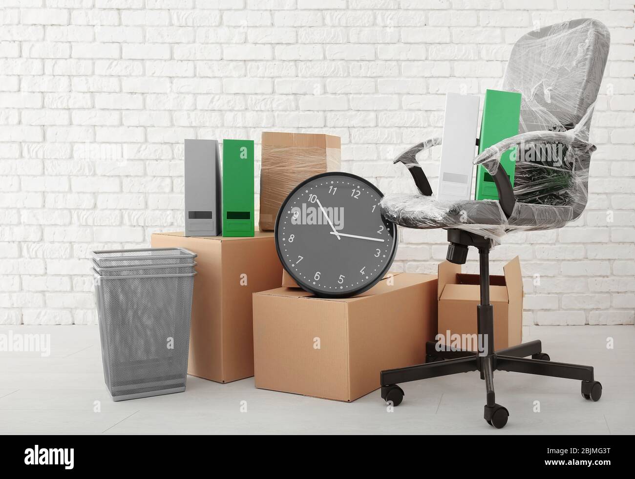 Office move concept. Carton boxes and chair on floor in empty room ...