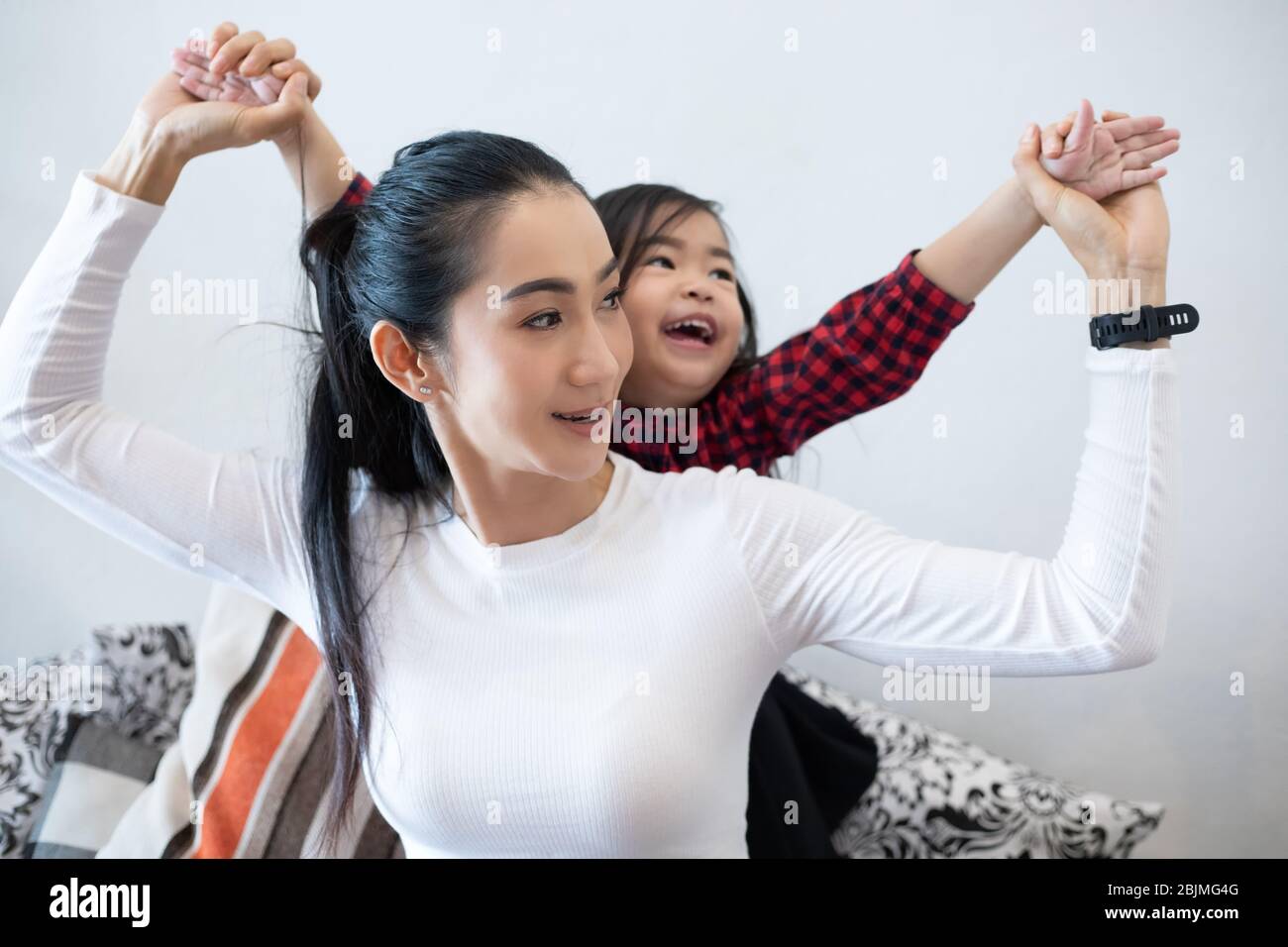 Mum children hugging sofa hi-res stock photography and images - Alamy