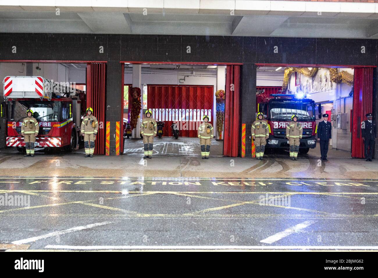 Firefighters at Soho Fire Station, Central London stand for a minute ...