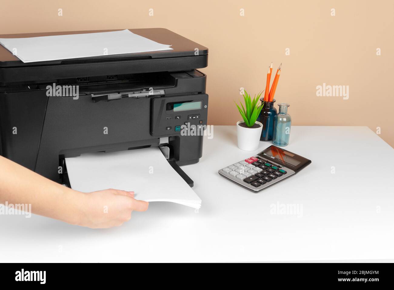 Woman using the printer to scanning and printing document Stock Photo ...