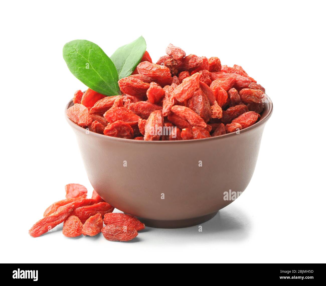 Bowl with red dried goji berries on white background Stock Photo - Alamy