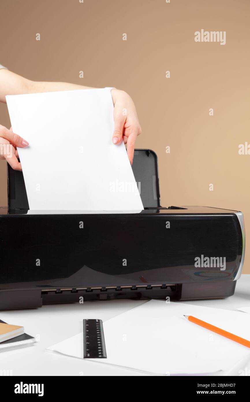Woman using the printer to scanning and printing document Stock Photo ...