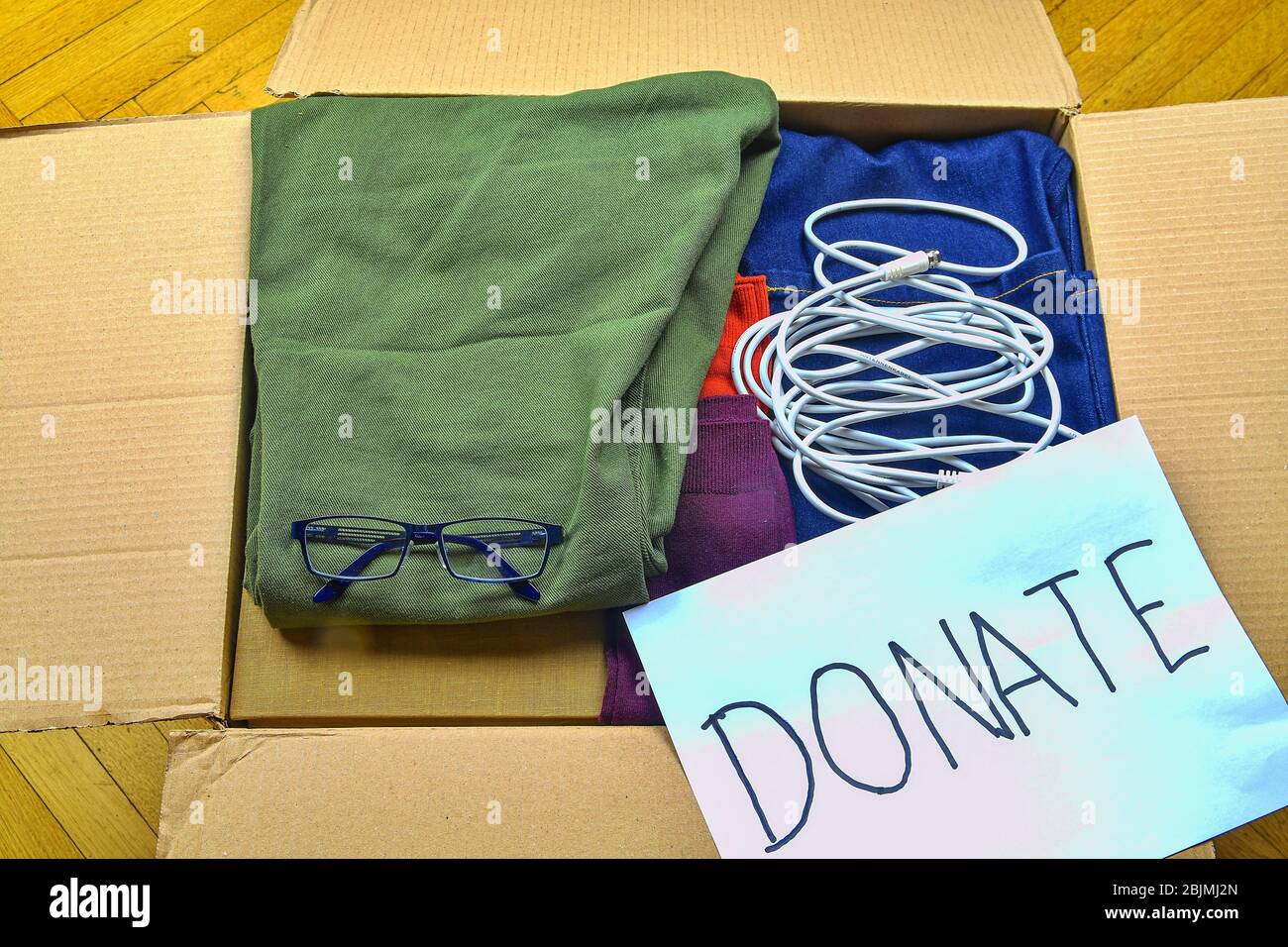 Donation concepts with text DONATE . Giving and sharing things with ...