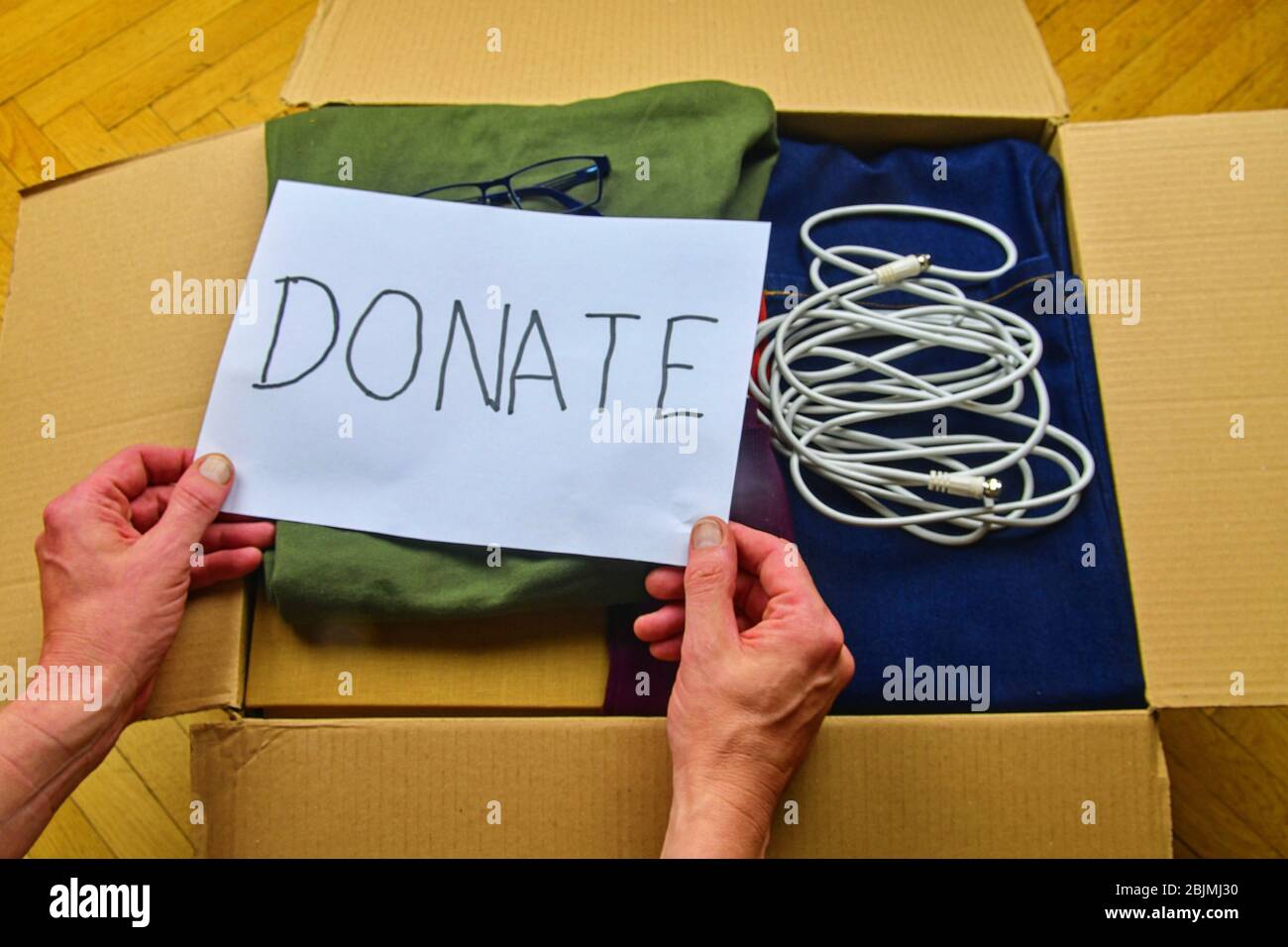 Donation concept. Donation box with donation clothes and accesories ...