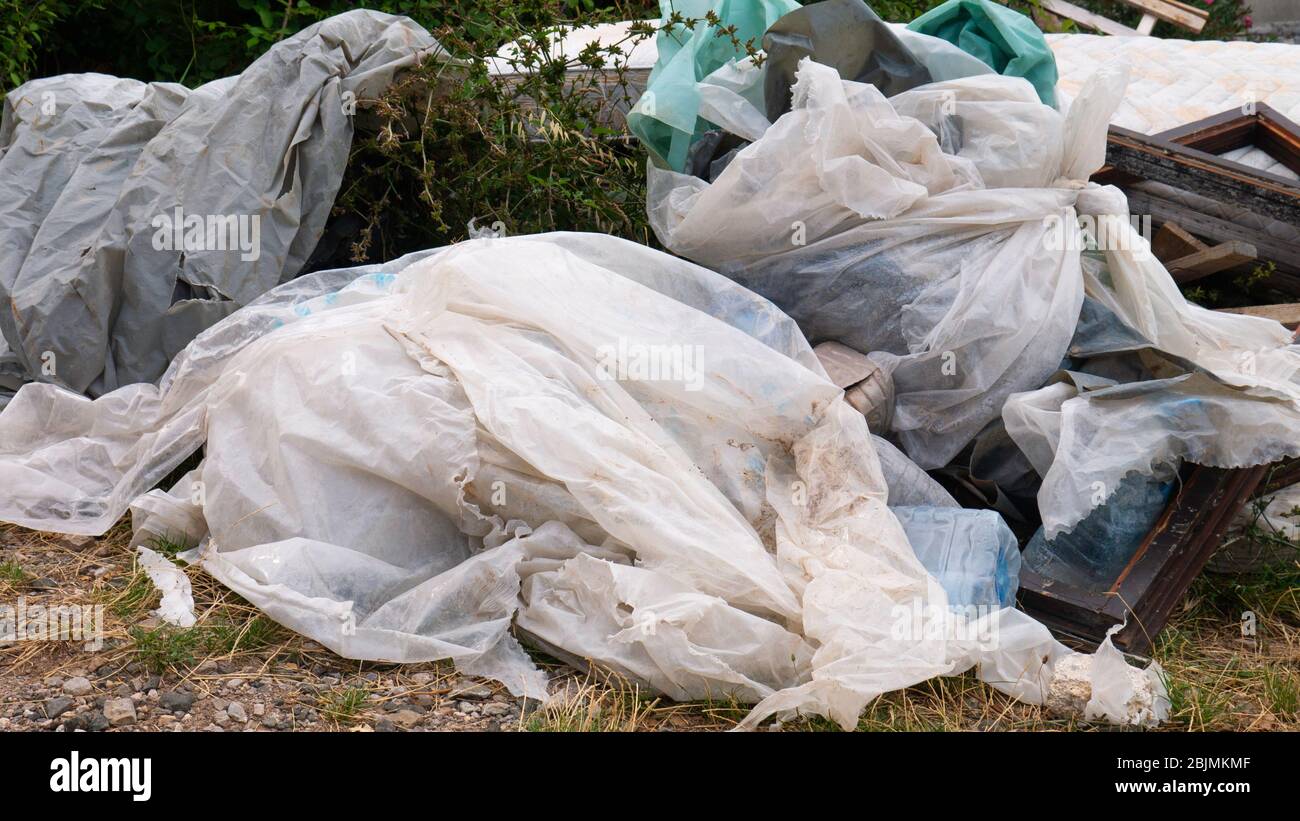 A pile of garbage of plastic bags and bottles. Plastic pollution Stock ...